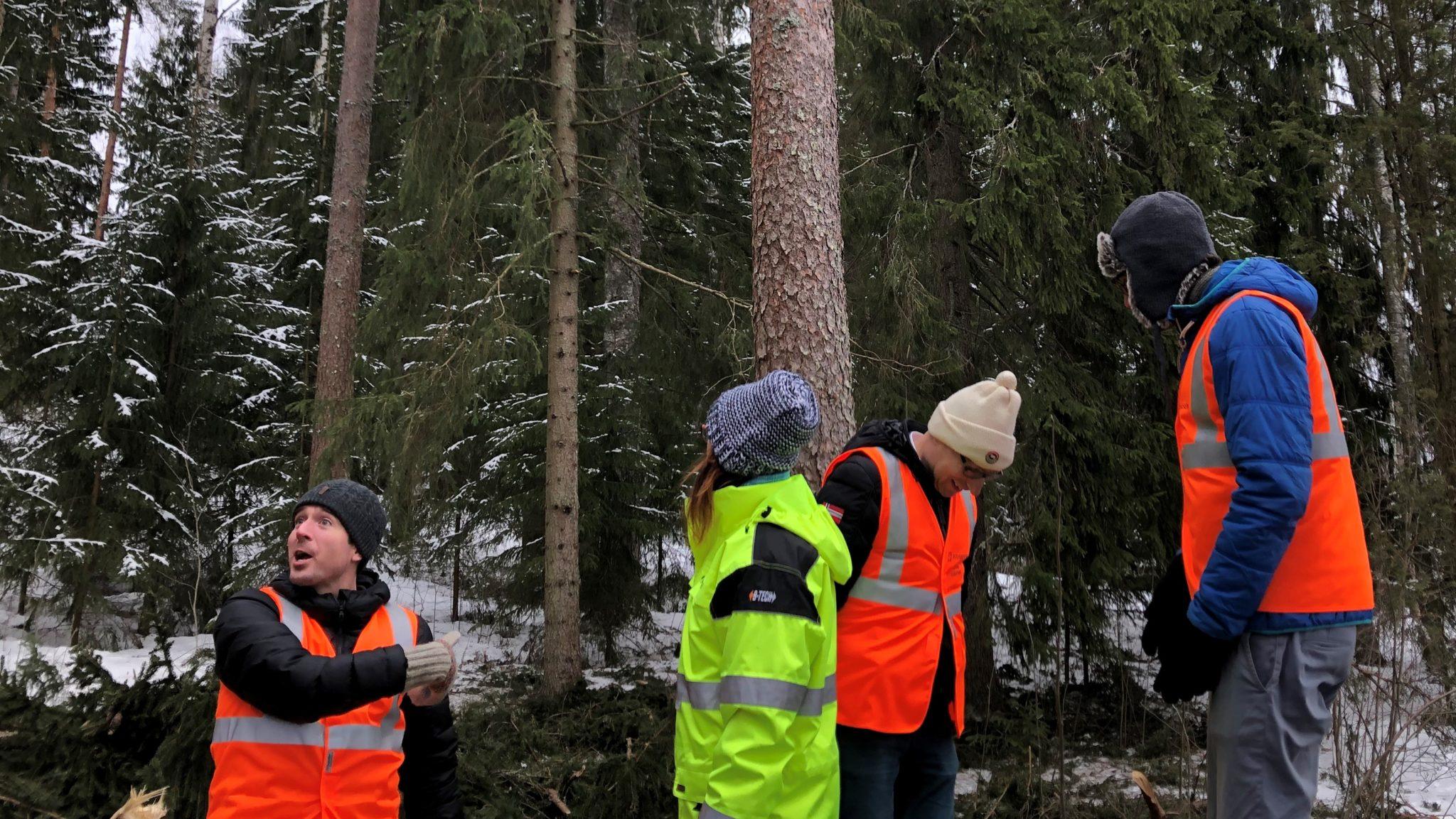 Development investors and forest company executives huddle in snow ...